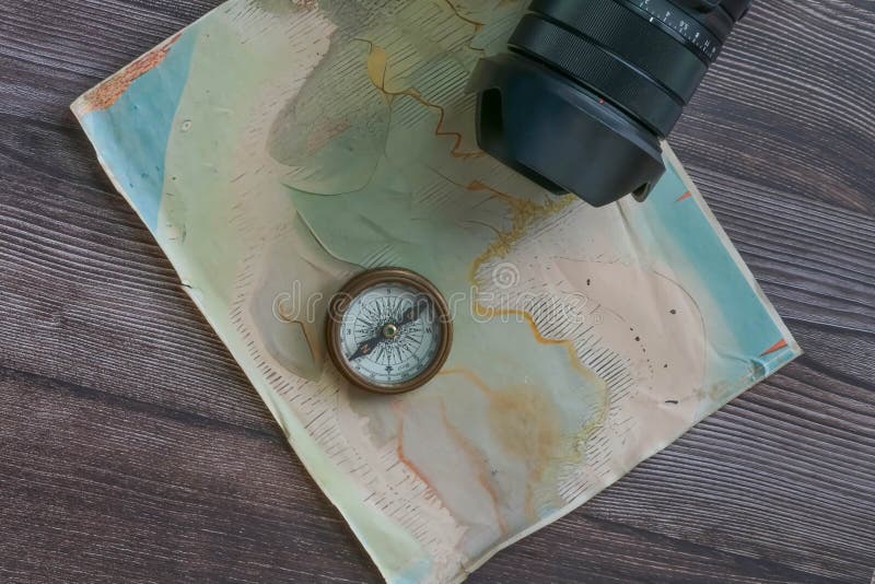 Old Fashioned Compass on a Vintage Map with Camera Stock Photo - Image ...