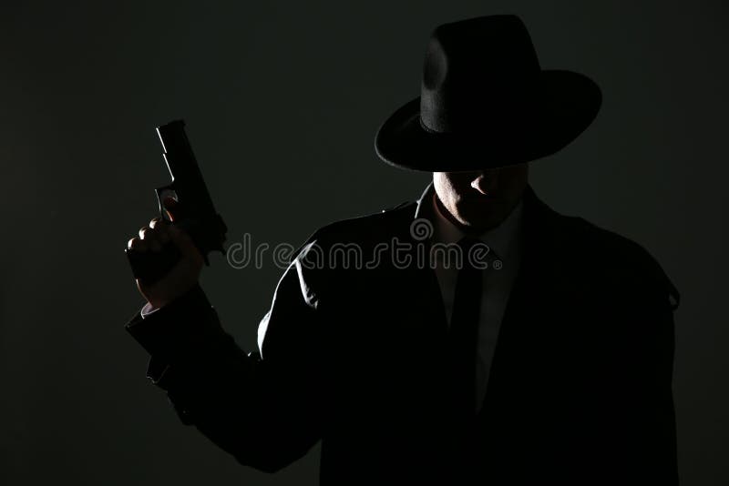 Old Fashioned Detective with Gun on Dark Background Stock Image - Image ...