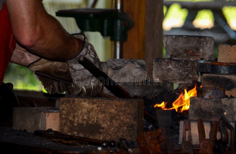 Old fashioned iron worker stock image. Image of tools - 43827919