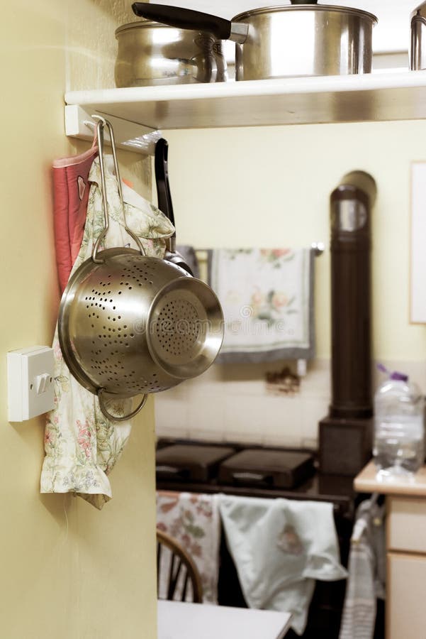 Old Fashioned Kitchen Interior with Utensils Hanging on the Wall Stock ...