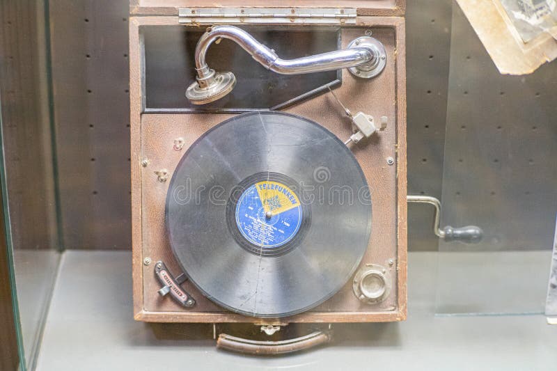 An Old-fashioned Record Player is Encased within a Glass Display with ...