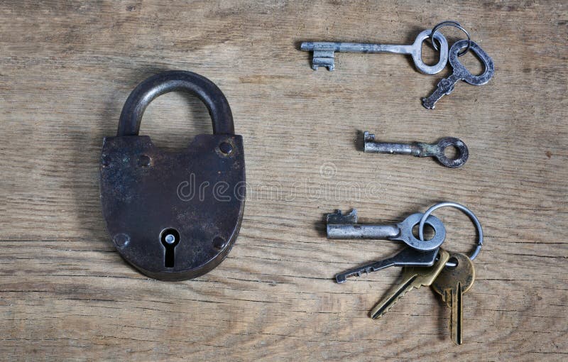 Old Fashioned Rusty Lock with Keys on Wooden Surface Stock Image ...