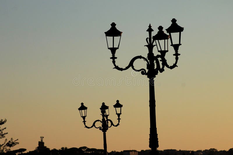 Old-fashioned Street Lamps Against a Sunset Stock Image - Image of ...
