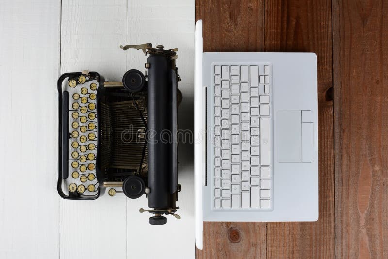 Old Fashioned Typewriter Back-to-back with a Modern Laptop Computer ...
