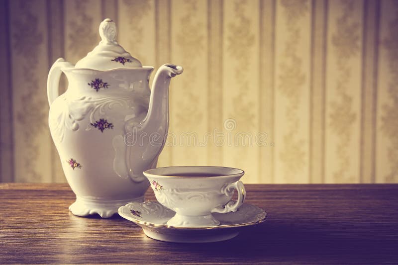 Old-fashioned Vintage Jug with Tea with Wallpaper Background Stock ...