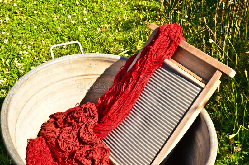 An Old Fashioned Washing Trougth Filled with Dyed and Washed Strings ...