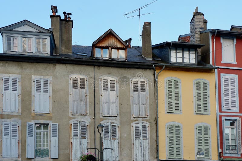 Old-fashioned Worn Facades with Old Windows and Shutters in Rustic Part ...