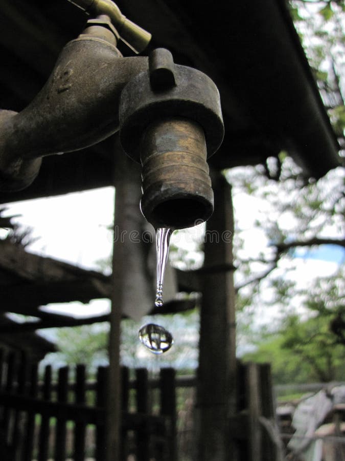 Old faucet with water drop stock photo. Image of faucet - 54603432