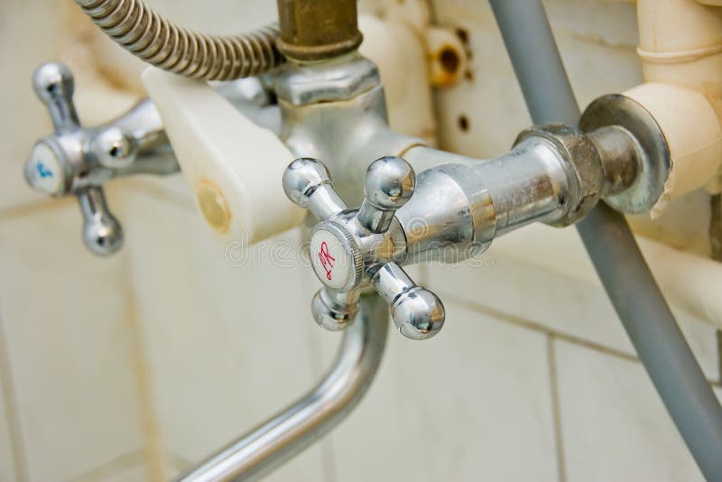Old faucets in a bathroom stock photo. Image of bathroom - 63947856
