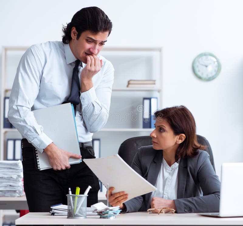 Old Female Boss and Young Male Employee in the Office Stock Image ...