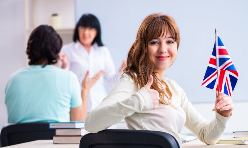 Old Female English Teacher and Students in the Classroom Stock Photo ...