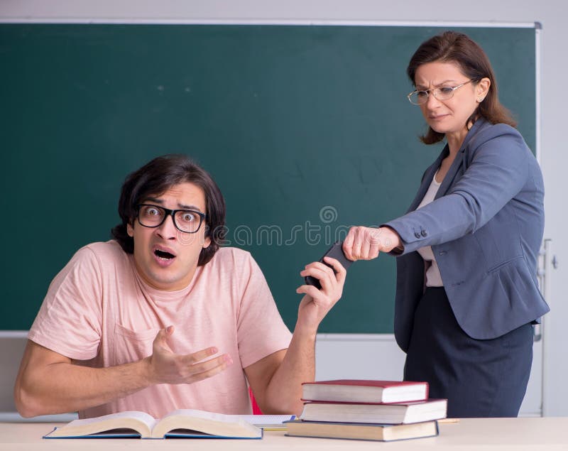 Old Female Teacher and Male Student in the Classroom Stock Image ...