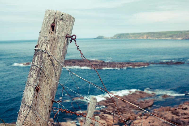 Old fence post by the sea stock photo. Image of ocean - 41498616