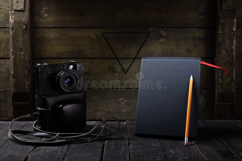 Old Film Camera and Notepad for Writing. Black Camera and Black Notepad ...