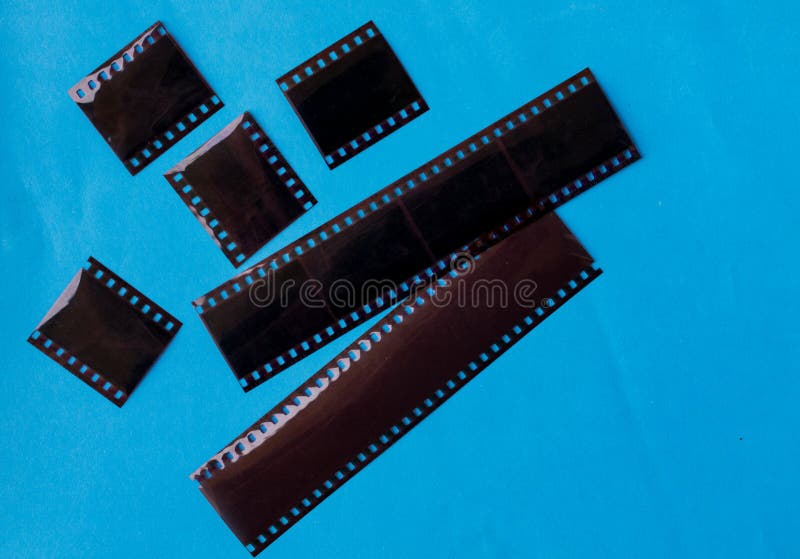 Old Film Negatives on a Plain Blue Colour Background Stock Image ...