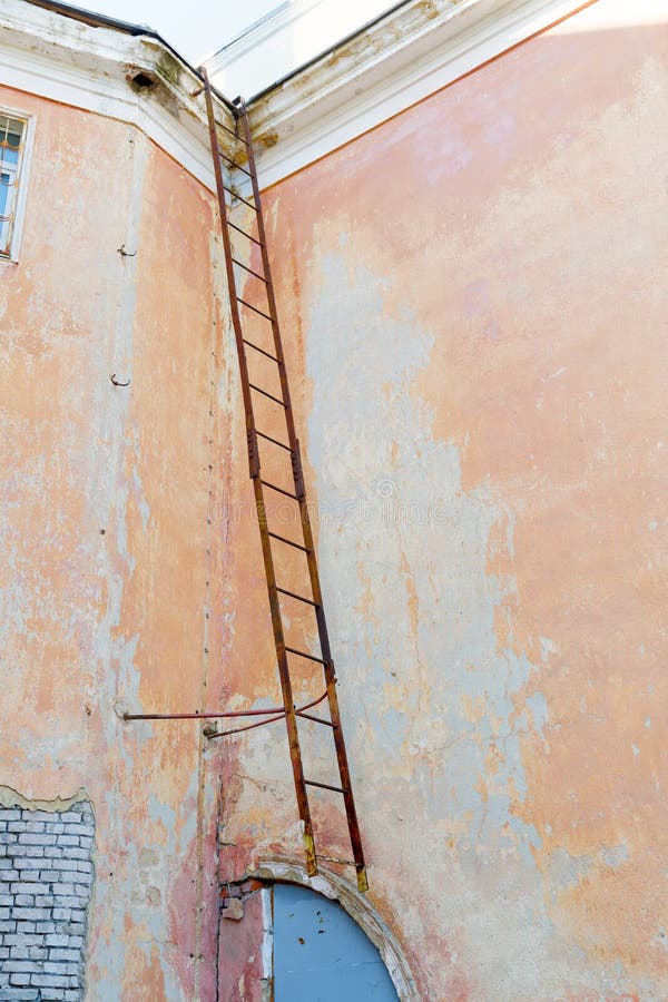 Old fire escape on a wall stock image. Image of housing - 76482859