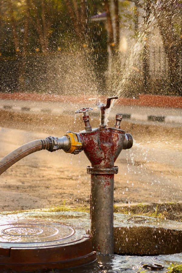 Old Fire Hydrant Under Pressure To Pass Water Stock Photo - Image of ...