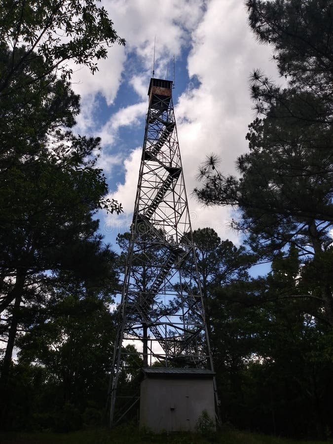Old fire tower in clearing stock image. Image of blue - 180578603