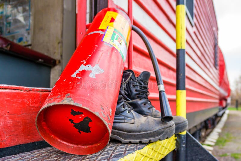 Old Firefighter Boots on the Background of Red Fire Train Stock Photo ...
