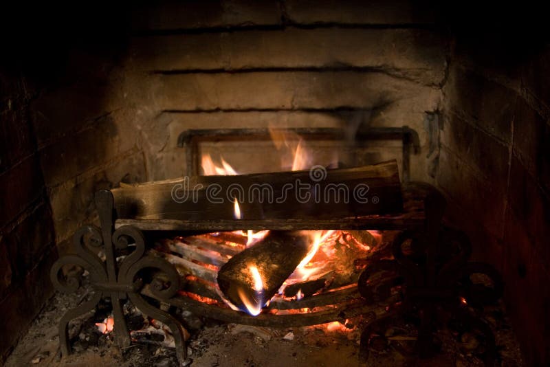 Old fireplace and a fire stock image. Image of closeup - 6291419