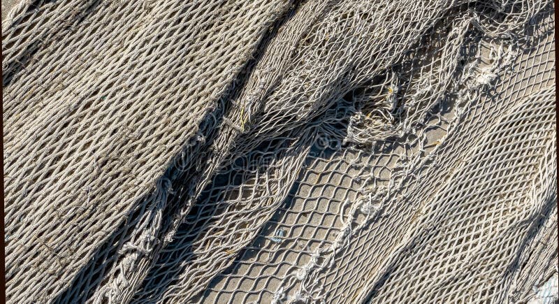 Old fishing net close-up stock image. Image of textured - 303812551