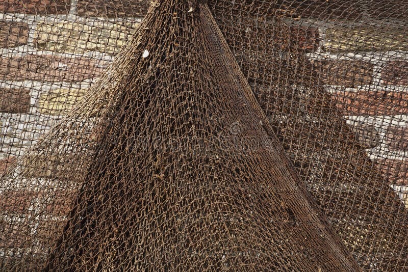 Old Fishing Nets Hanging on a Wall Stock Photo - Image of lines, drag ...