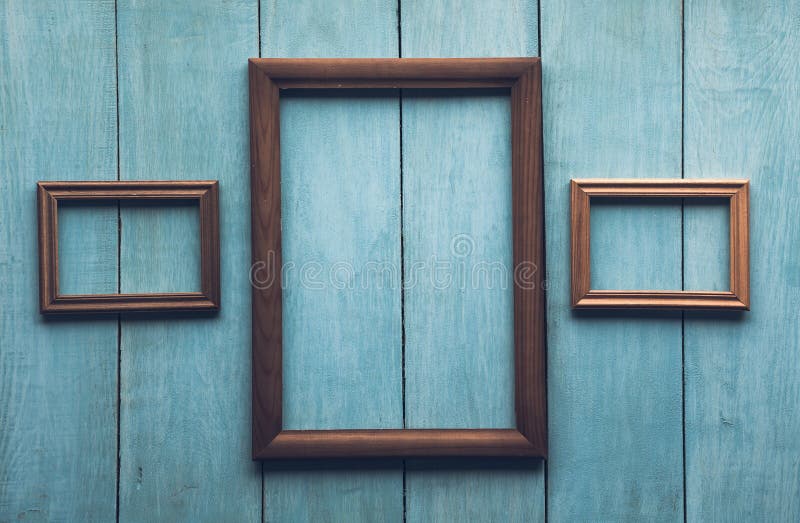 Old frames on wooden wall stock photo. Image of exhibition - 187128796