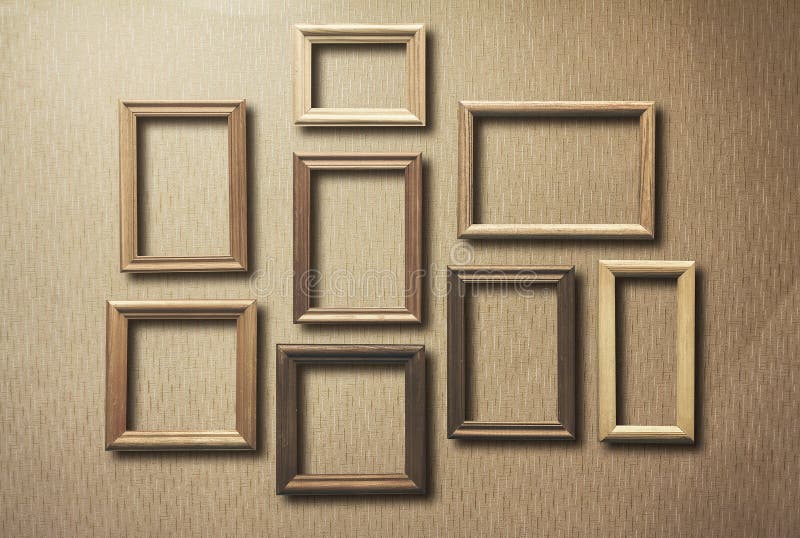 Old frames on wooden wall stock photo. Image of border - 208724684