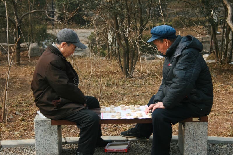 Old friends playing a game editorial image. Image of friends - 59876350