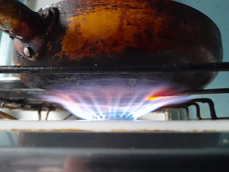 Old Frying Pan on a Prite on a Burning Fire, Blue Fuel Stock Photo ...