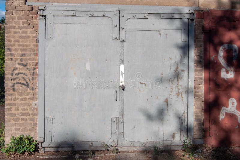 Old garage doors stock image. Image of padlock, scratched - 255471865