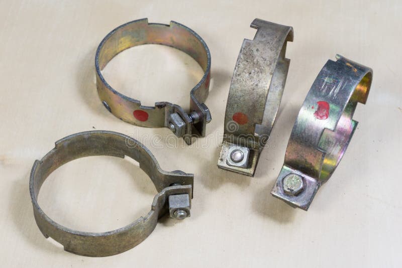 Old Garden Accessories. Rusty Hose Clamps on the Workshop Table Stock ...