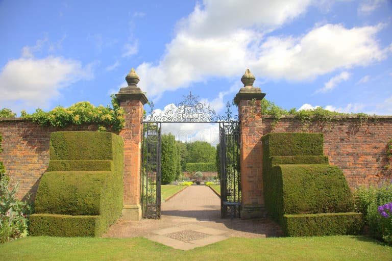 Old Garden Gates with Topiary Shrubs Stock Photo - Image of garden ...