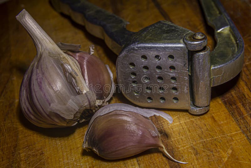 Old Garlic Press and Root Vegetables Stock Image - Image of fresh ...