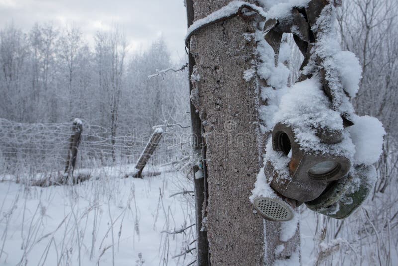 Old Gas Mask Hanging on a Pole in Winter. Snow Covered. Stock Photo ...