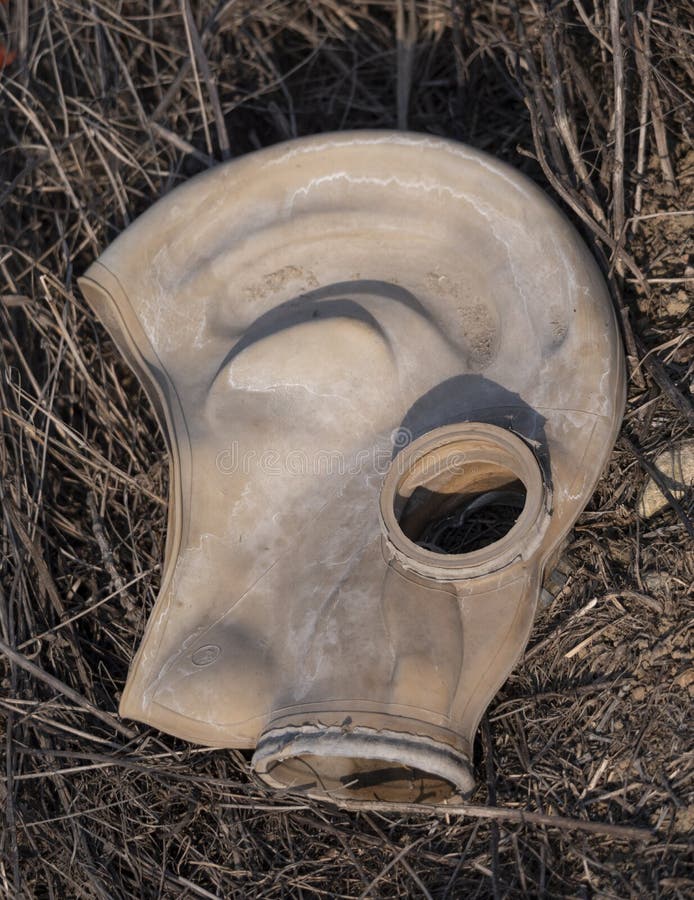 An Old Gas Mask Lies in a Field on the Ground Stock Image - Image of ...
