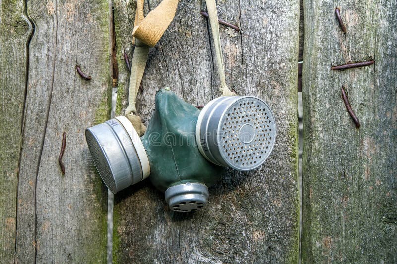 An Old Gas Mask on Rough Boards. Gas Mask with Filters Stock Image ...