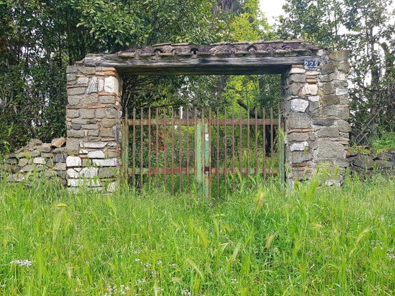 Old Gate in a Meadow with Green Grass and a Stone Wall Stock Image ...
