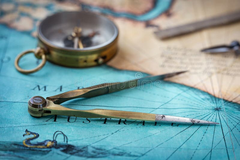An Old Geographic Map with Navigational Tools: Compass, Divider, Ruler ...