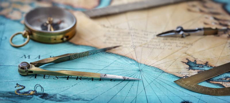 An Old Geographic Map with Navigational Tools: Compass, Divider, Ruler ...