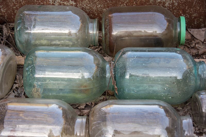 Old Glass Cylinders of Three Liters Stacked in Rows Stock Image - Image ...