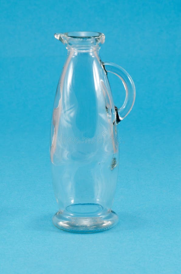 Old Glass Jug Jar Pitcher Handle on Blue Stock Photo - Image of ...