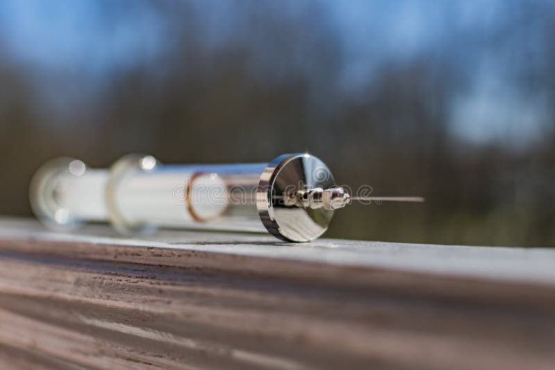 An Old Glass Syringe with a Needle Stock Photo - Image of science ...