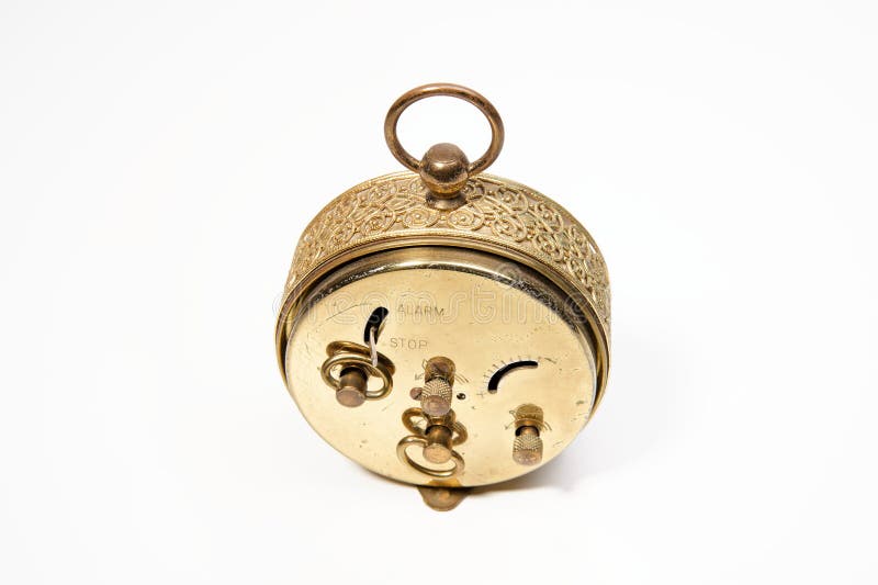 An Old Golden Analog Alarm Clock with Mechanical Movement Stock Photo ...