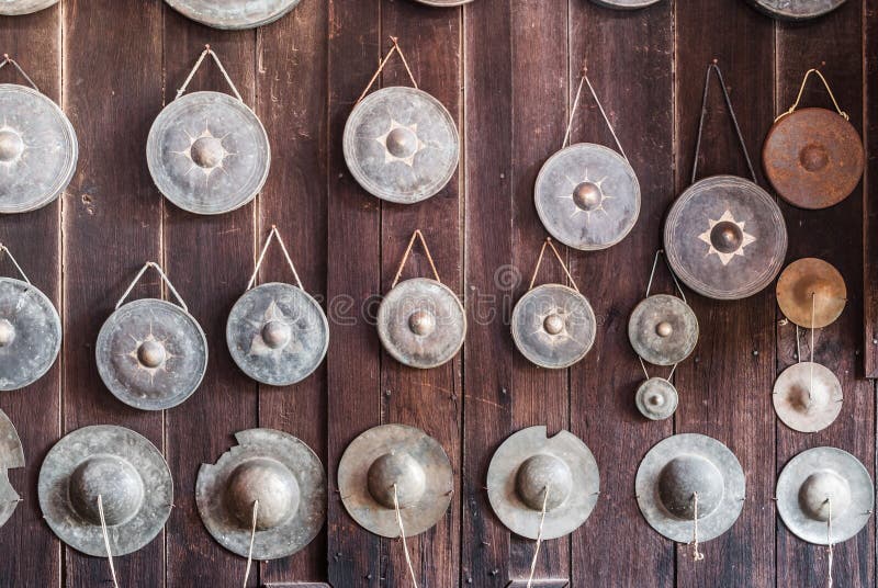 Old Gongs and Chipped Cymbal on Wood Wall Stock Image - Image of stain ...