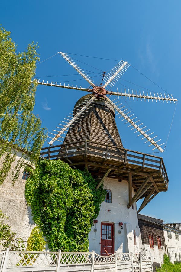 Old grain mill in Denmark stock photo. Image of bridge - 220603516