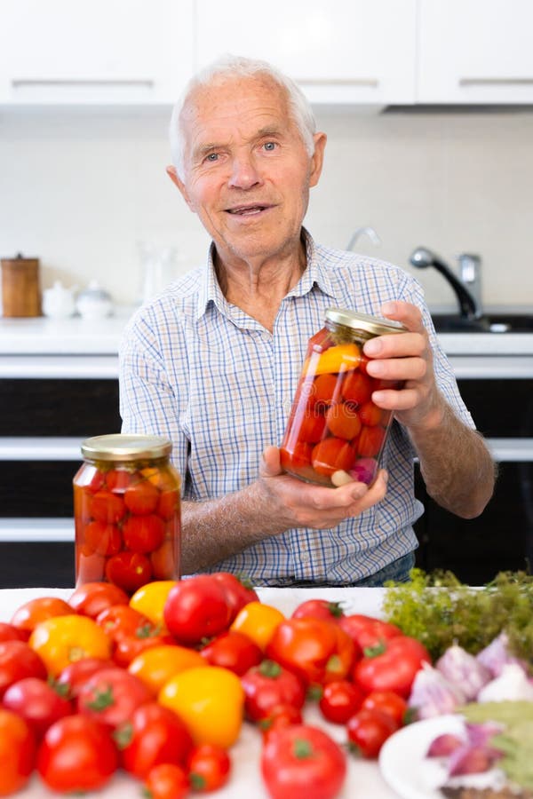 Old Gray Haired Man Makes Harvests for the Winter Pickles Tomatoes ...
