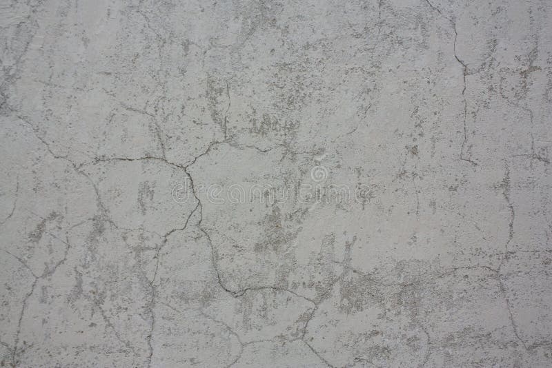 An Old, Gray Wall with Cracks and Damage. Worn Surface Stock Photo ...