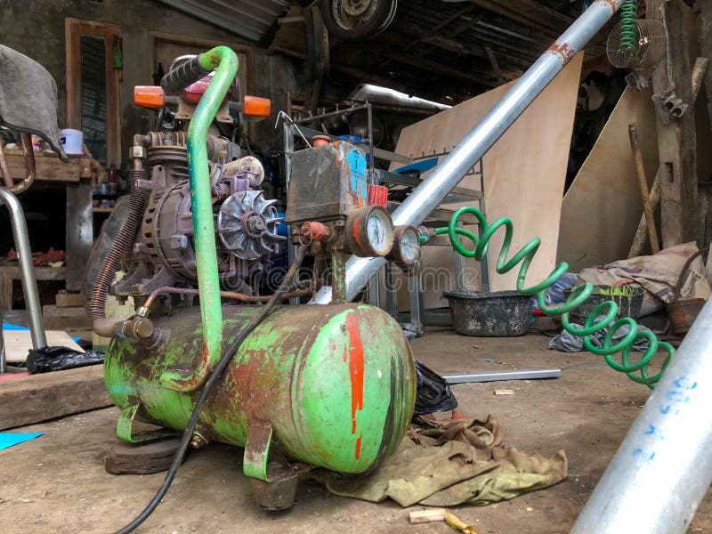 Old green air compressor stock photo. Image of city - 316683310