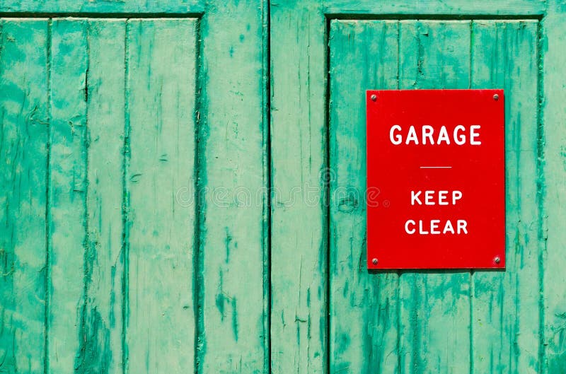 Old Green Wooden Garage Doors with a Red Sign - Keep Clear Stock Photo ...